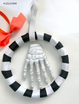 DIY Halloween Skeleton Hand Wreath - Lolly Jane